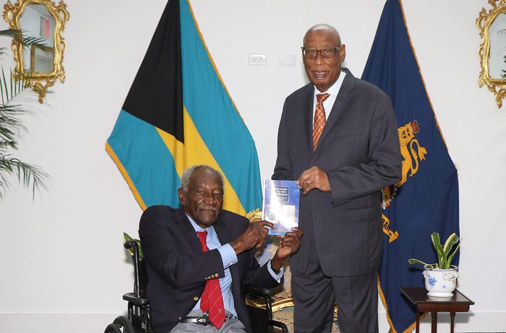 Paul Thompson presents a copy of his book to the Governor General - ZNS ...