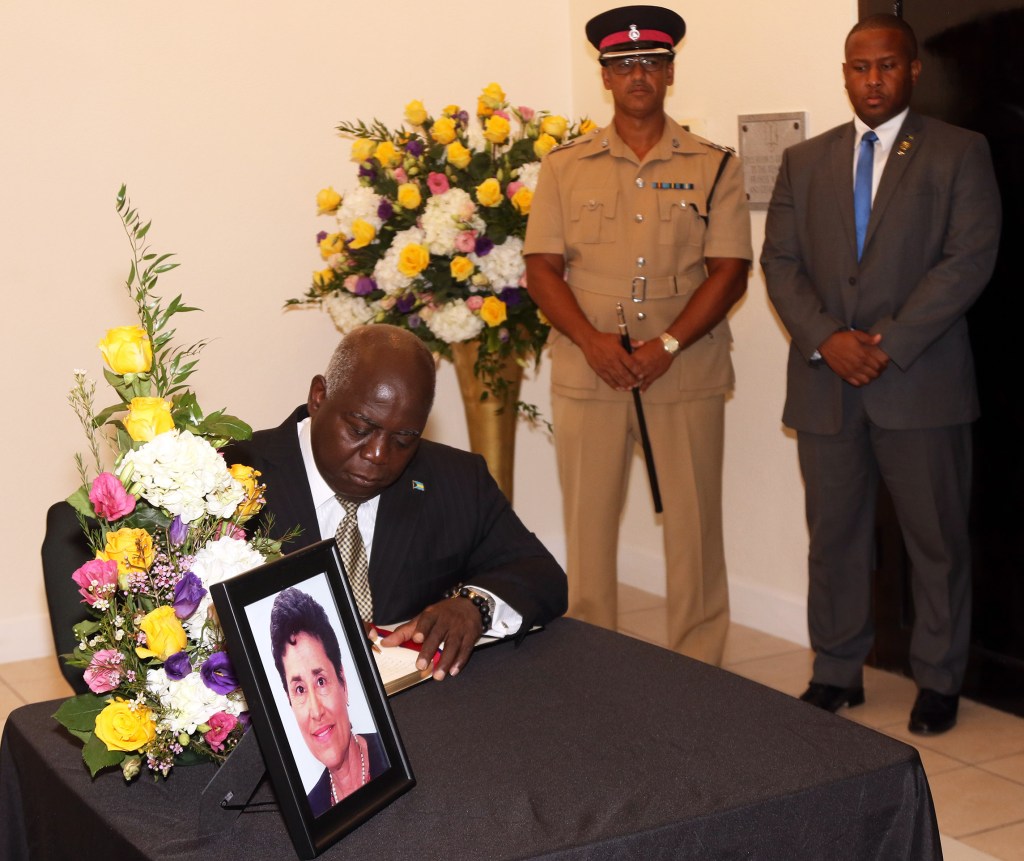 Prime Minister Davis signs the Book of Condolence for the late Rt. Hon ...