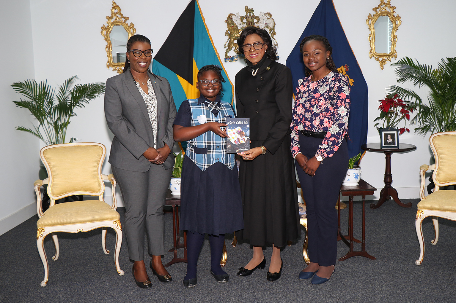Sixth Grade Student, Lavaria Storr presents a copy of her book to the ...