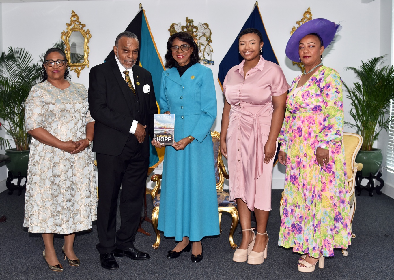 Bishop Dr. Glen Beneby makes a book presentation to the Governor ...
